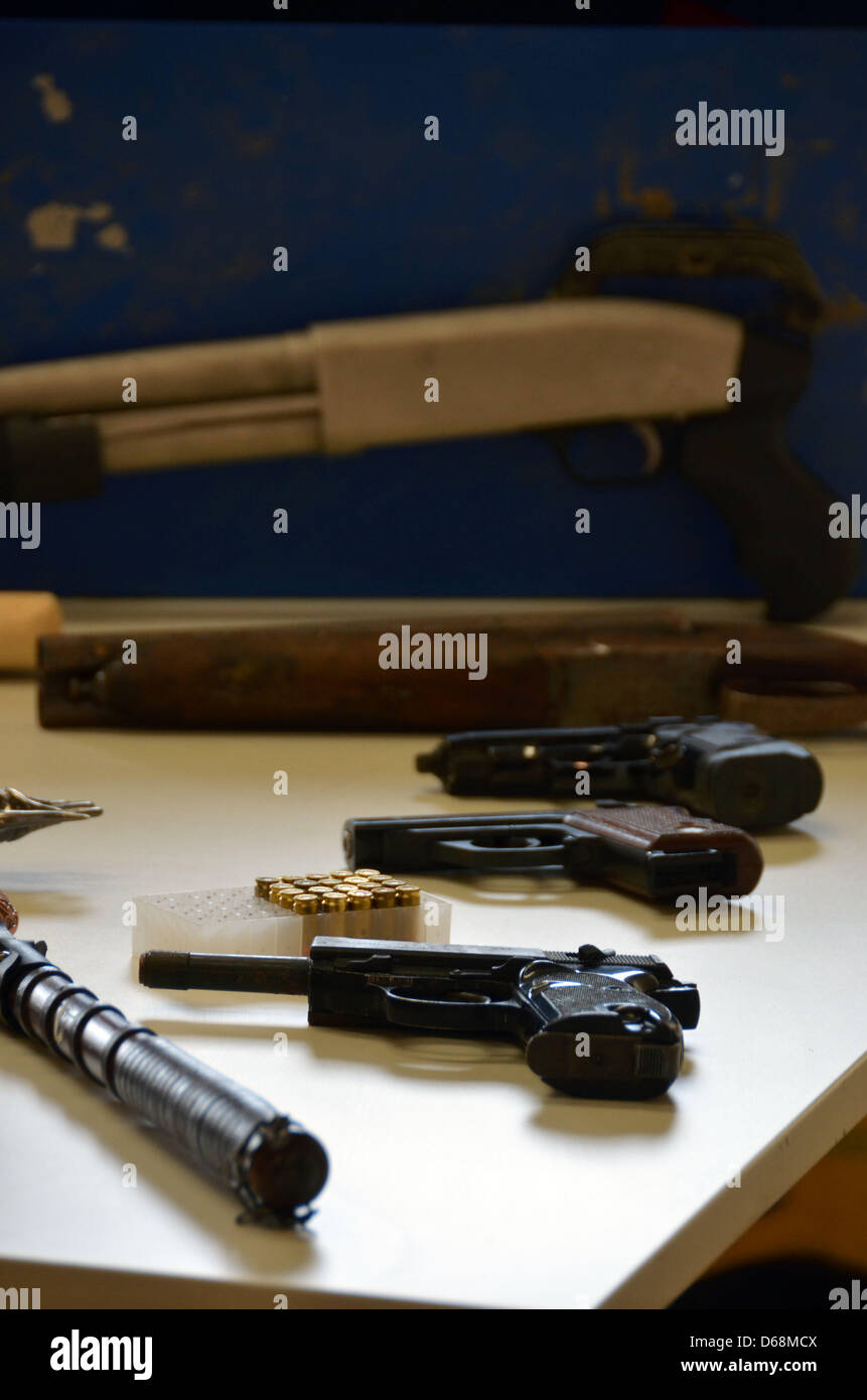 The police display weapons confiscated during a raid on the Hells ...