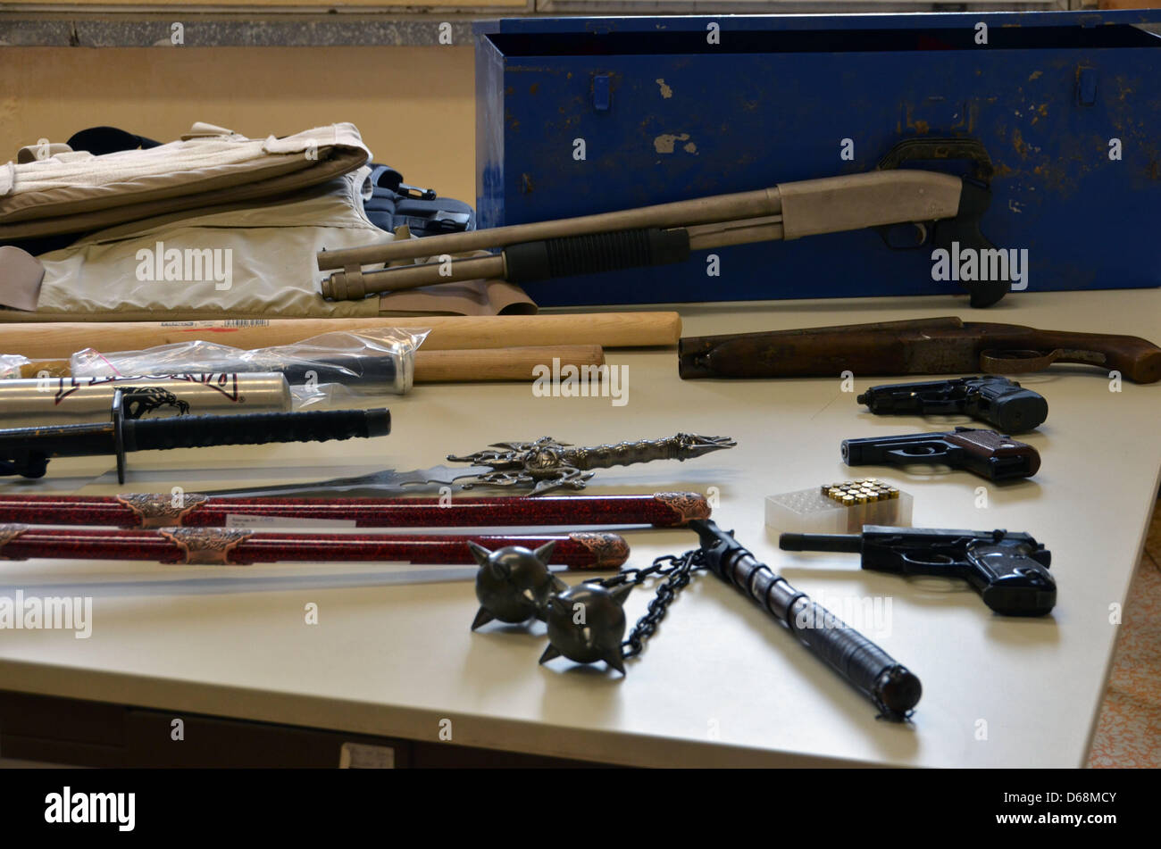 The police display weapons confiscated during a raid on the Hells ...