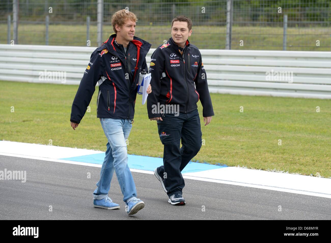 German Formula One driver Sebastian Vettel of Red Bull (L) and his ...