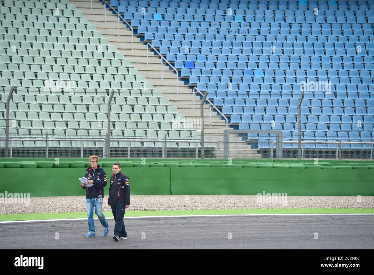 German Formula One driver Sebastian Vettel of Red Bull (L) and his ...