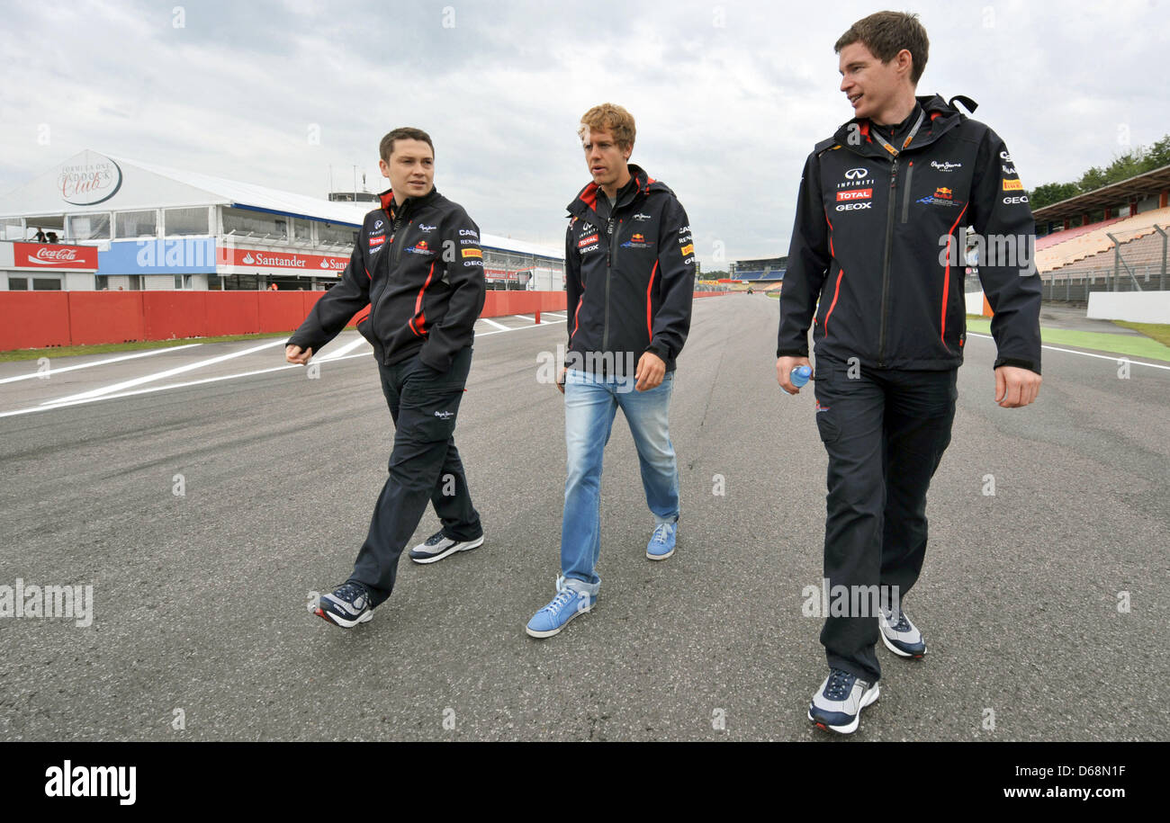 German Formula One driver Sebastian Vettel of Red Bull Racing (M) and ...