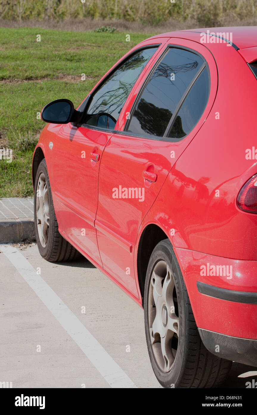 red car parked in the lot Stock Photo - Alamy
