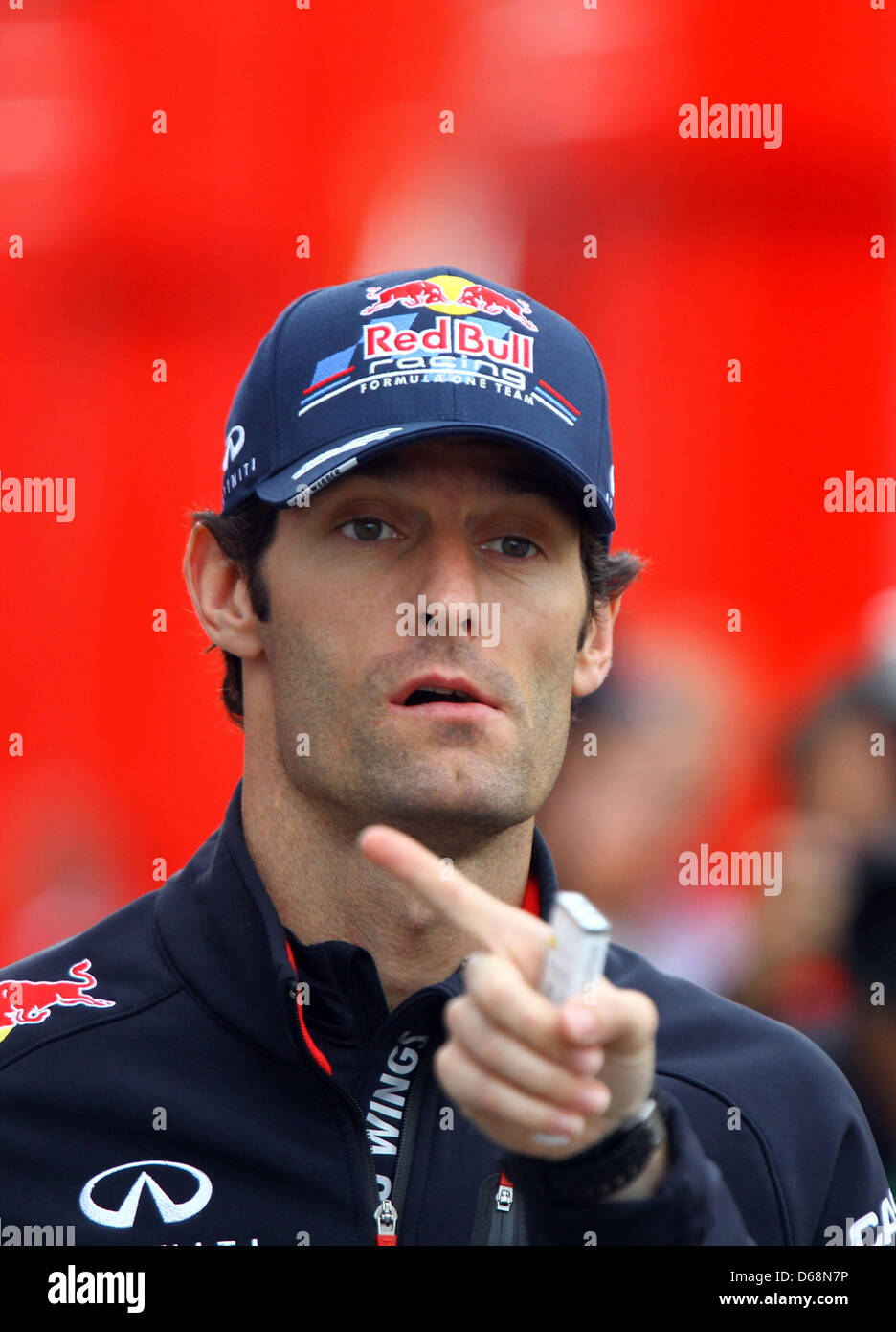Australian Formula One driver Mark Webber of Red Bull walks through the ...