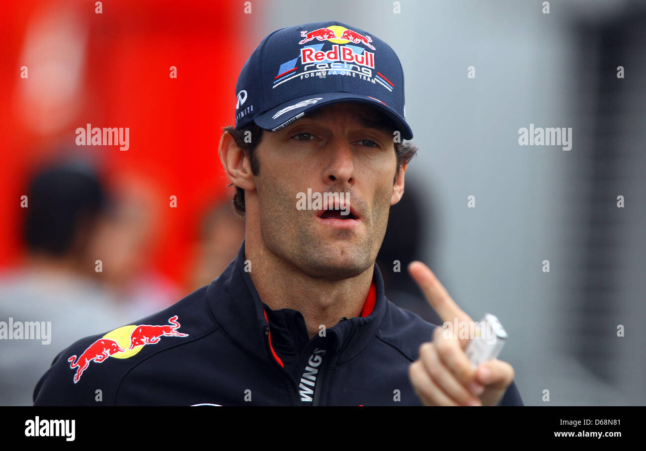 Australian Formula One driver Mark Webber of Red Bull walks through the ...