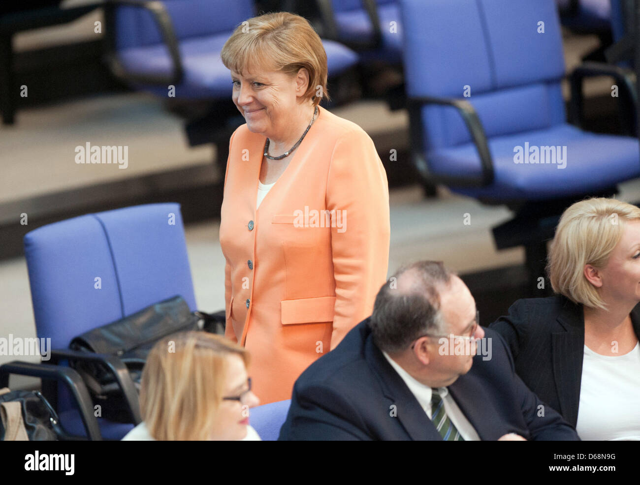 German Chancellor Angela Merkel (CDU) walks through the plenar hall ...