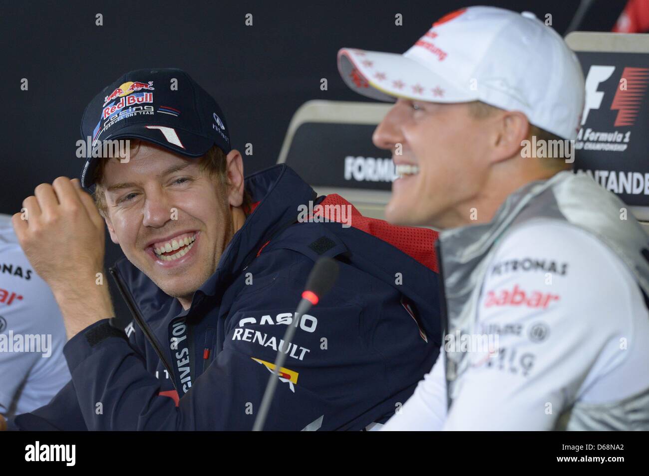 German Formula One driver Sebastian Vettel of Red Bull (L) and German ...