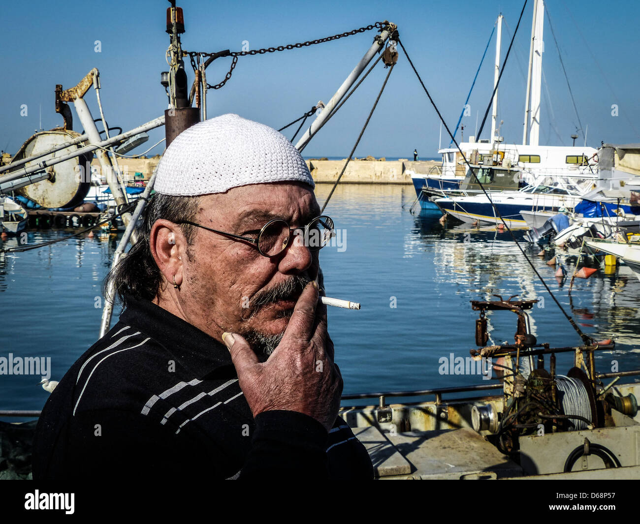 Israel, Jaffa, The ancient port now fishing port A local fisherman ...