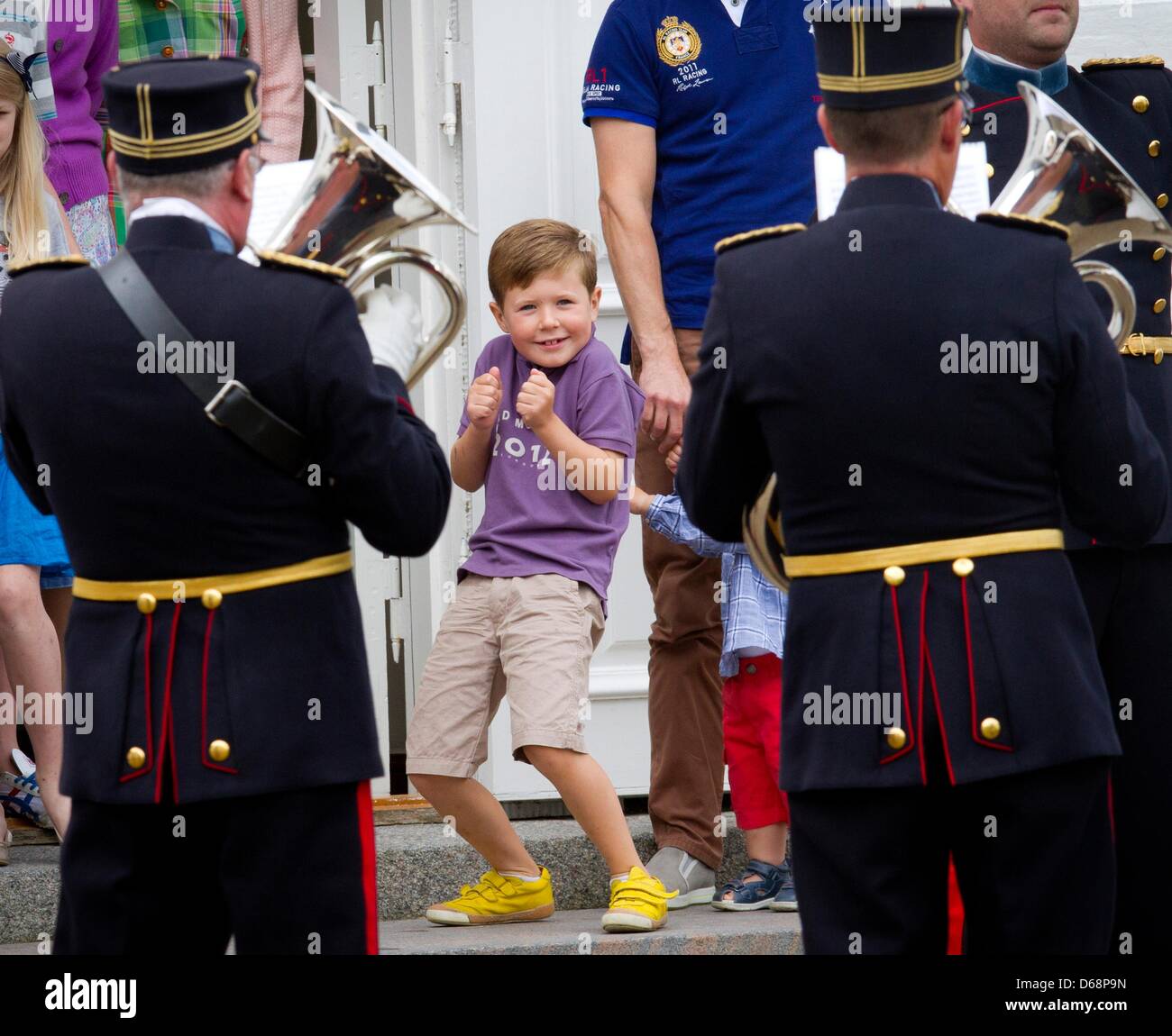Prince Christian dances to the music before attending the annual photo ...