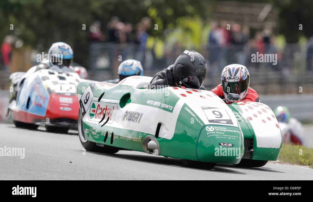 Sidecar drivers and co-drivers race during free training for the ...
