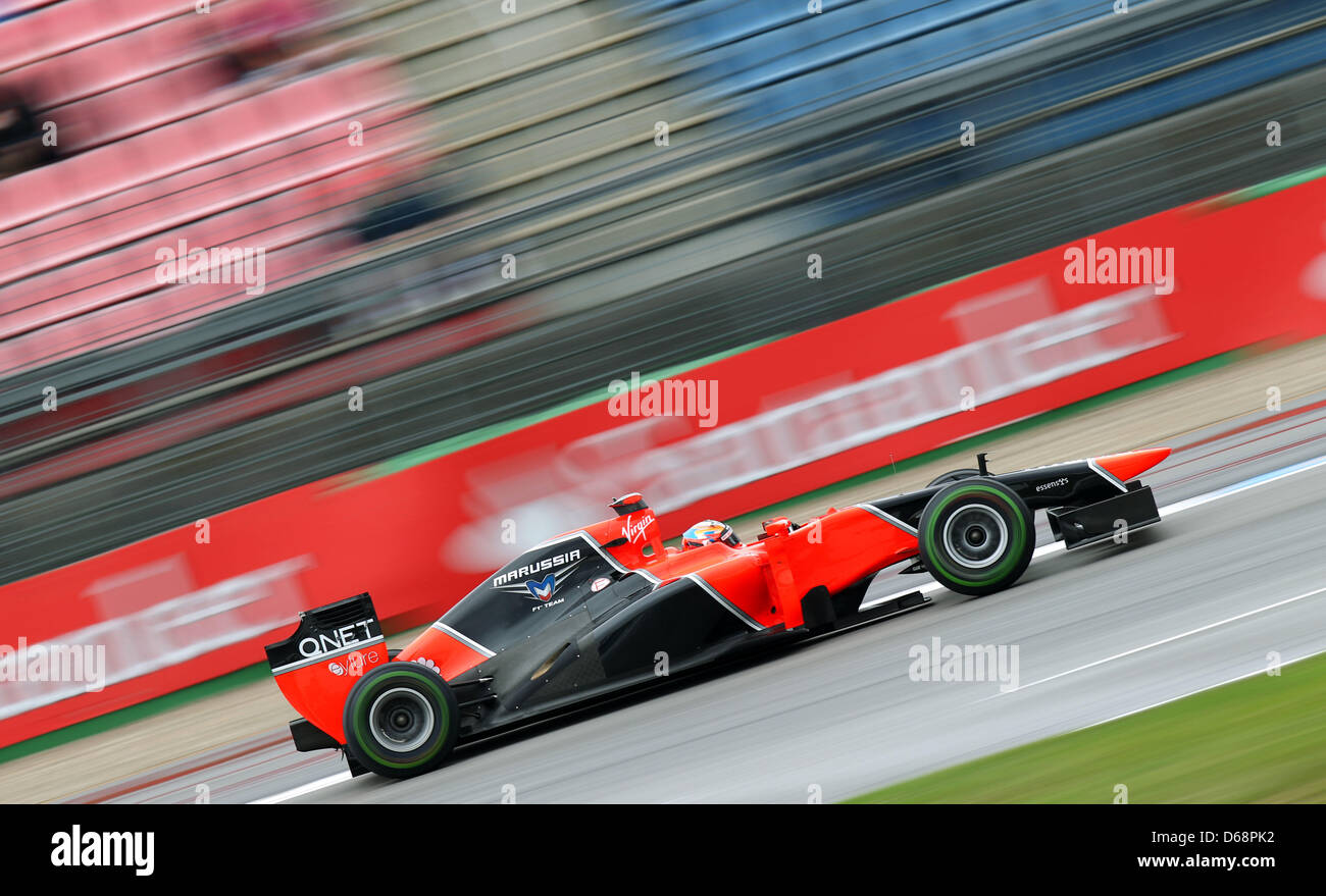German Formula One driver Timo Glock of Marussia steers his car through ...
