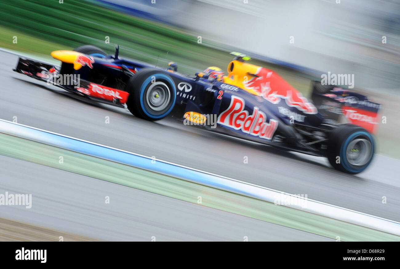 Australian Formula One driver Mark Webber of Red Bull drives through ...