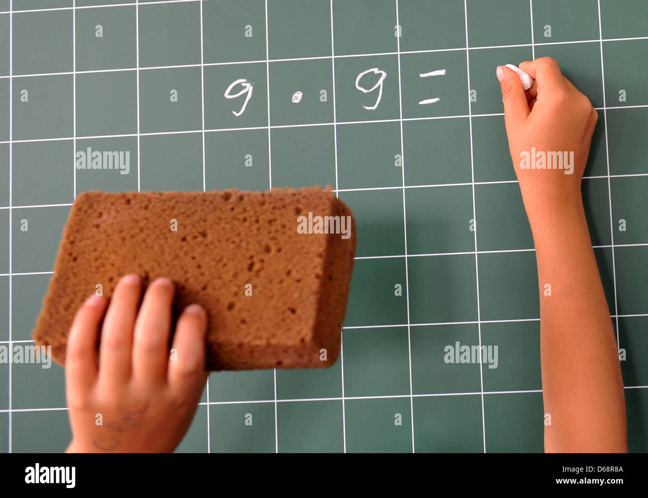 (ILLUSTRATION) An illustration shows a child doing a math problem on ...
