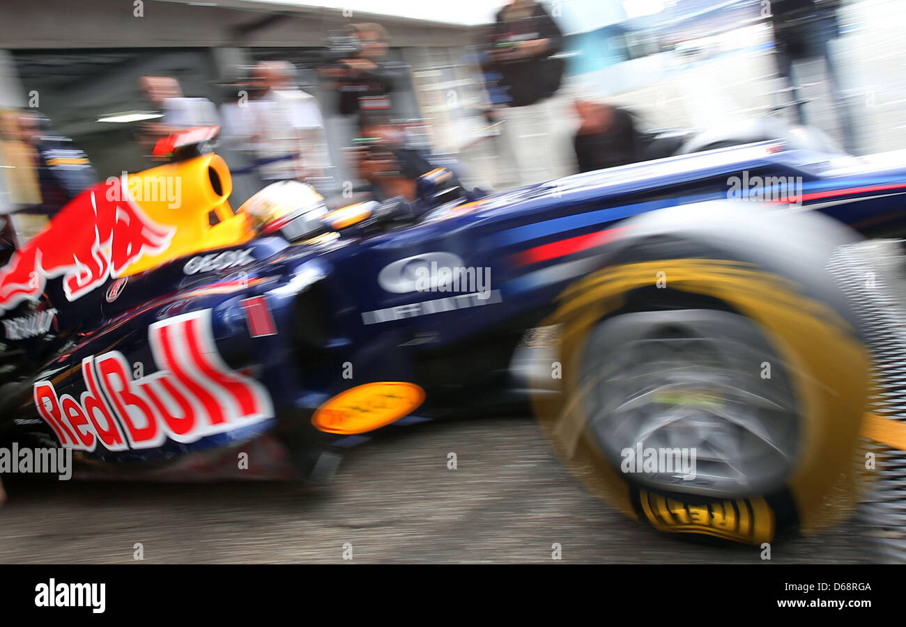 German Formula One driver Sebastian Vettel of Red Bull leaves the pits ...
