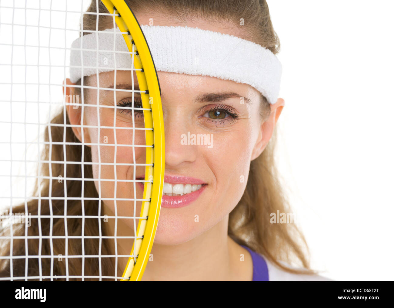 Portrait of female tennis player with racket in front of face Stock ...