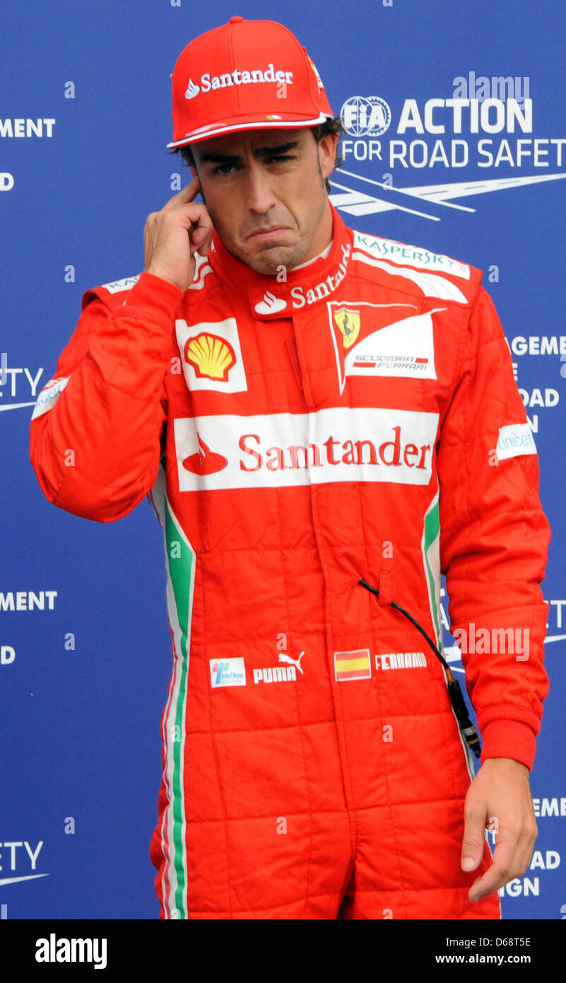 Spanish Formula One driver Fernando Alonso of Ferrari reacts after the ...