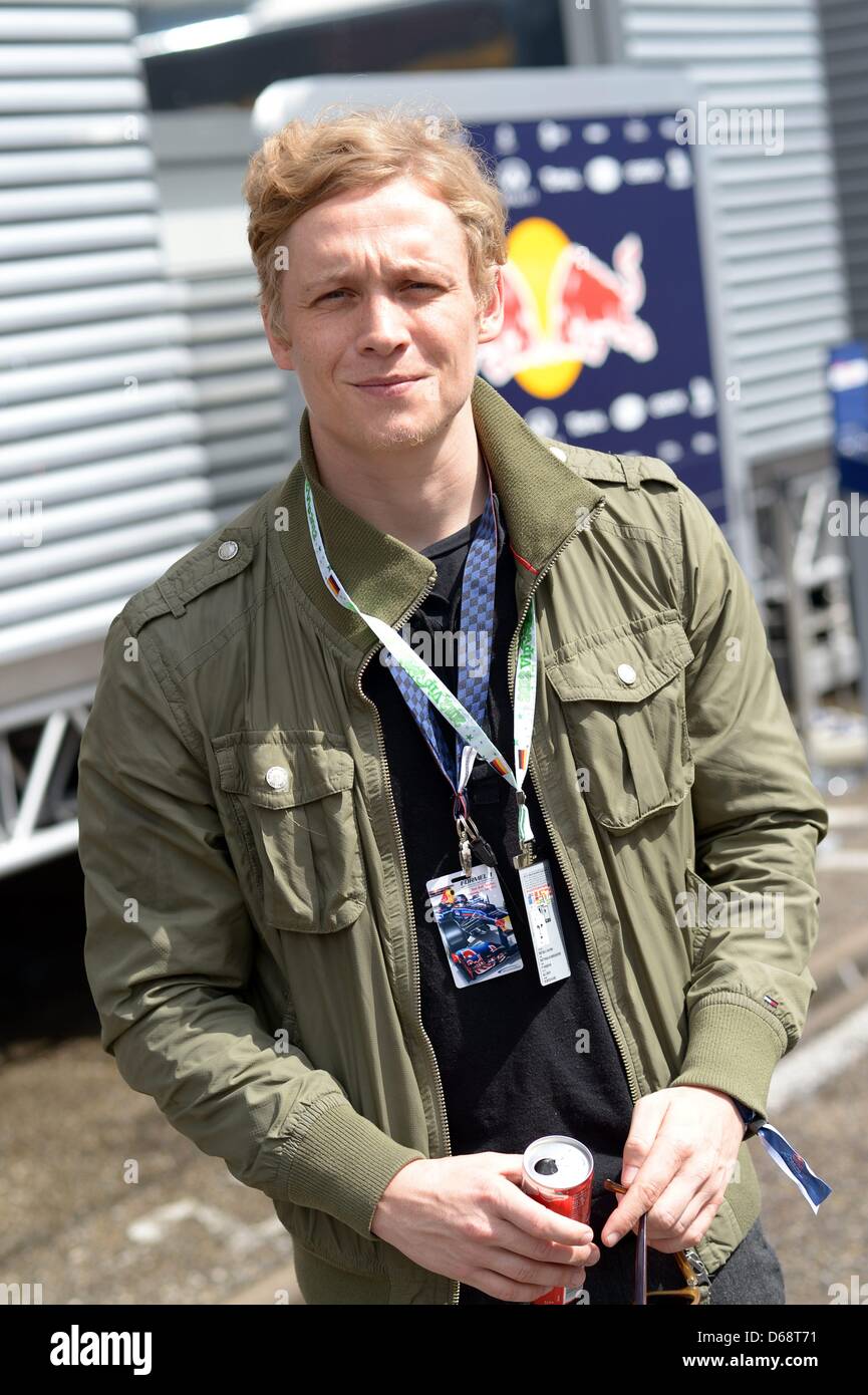 German actor Matthias Schweighoefer smiles in the paddock at the ...