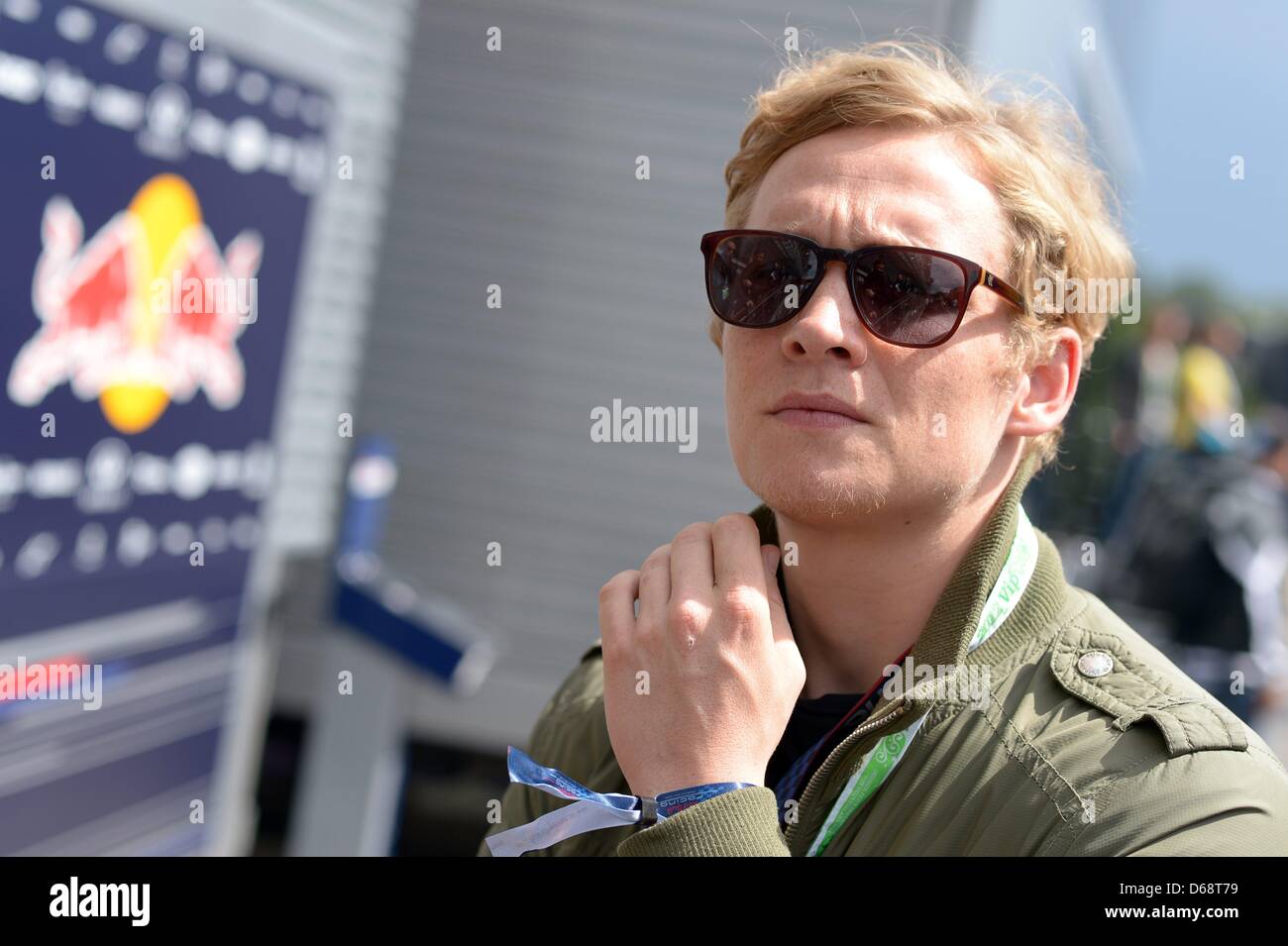 German actor Matthias Schweighoefer smiles in the paddock at the ...