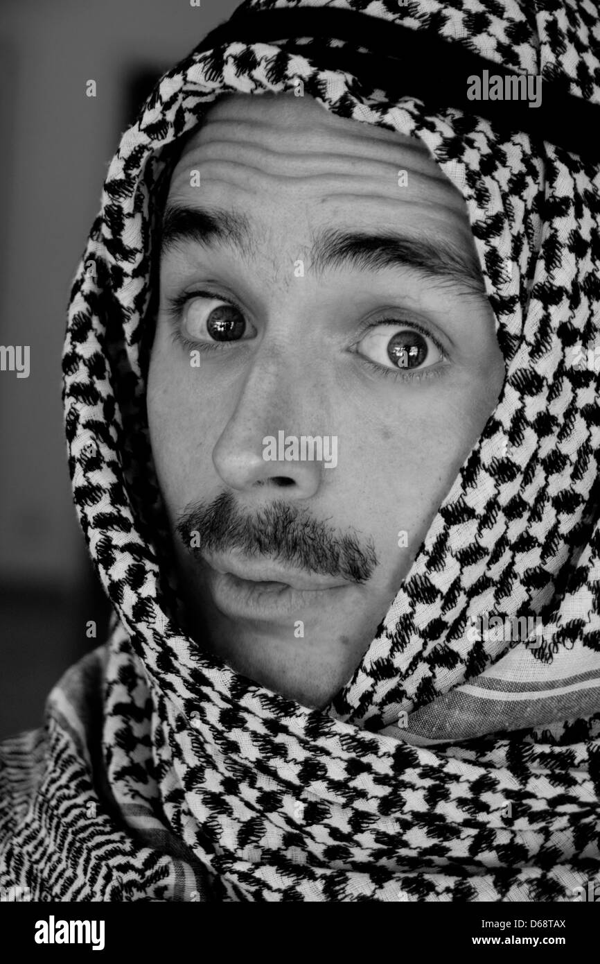 A portrait of a young Arab Man wearing a kaffiyeh Model Release ...