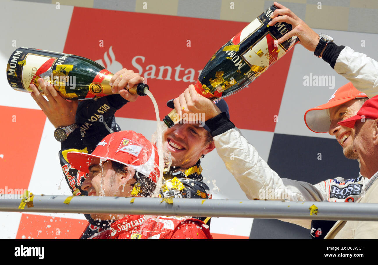 Spanish Formula One driver Fernando Alonso (C) of Ferrari celebrates ...
