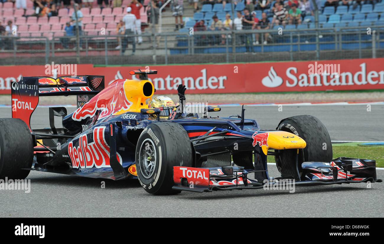 German Formula One driver Sebastian Vettel of Red Bull waves to the ...