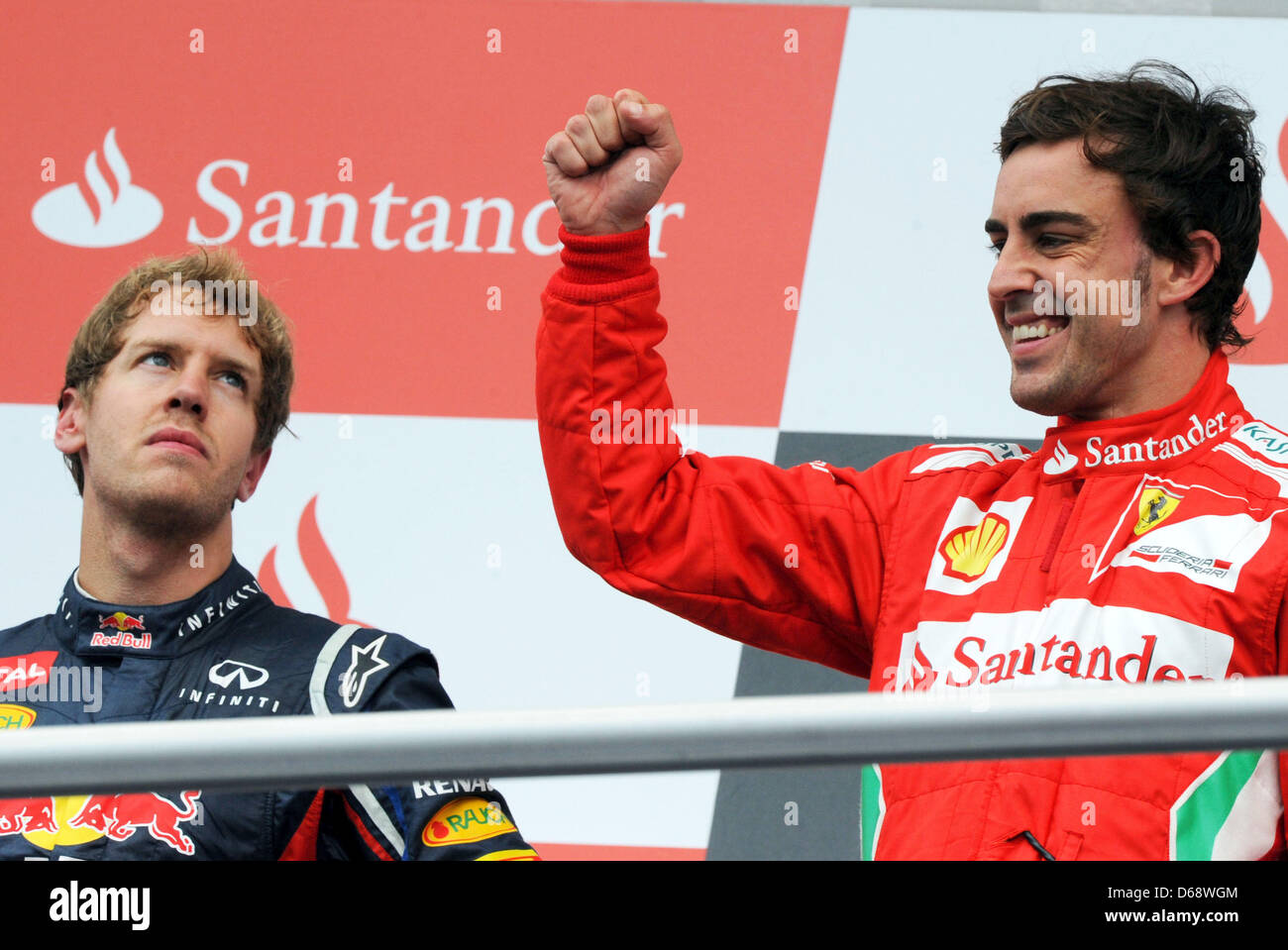 Spanish Formula One driver Fernando Alonso (R) of Ferrari celebrates ...