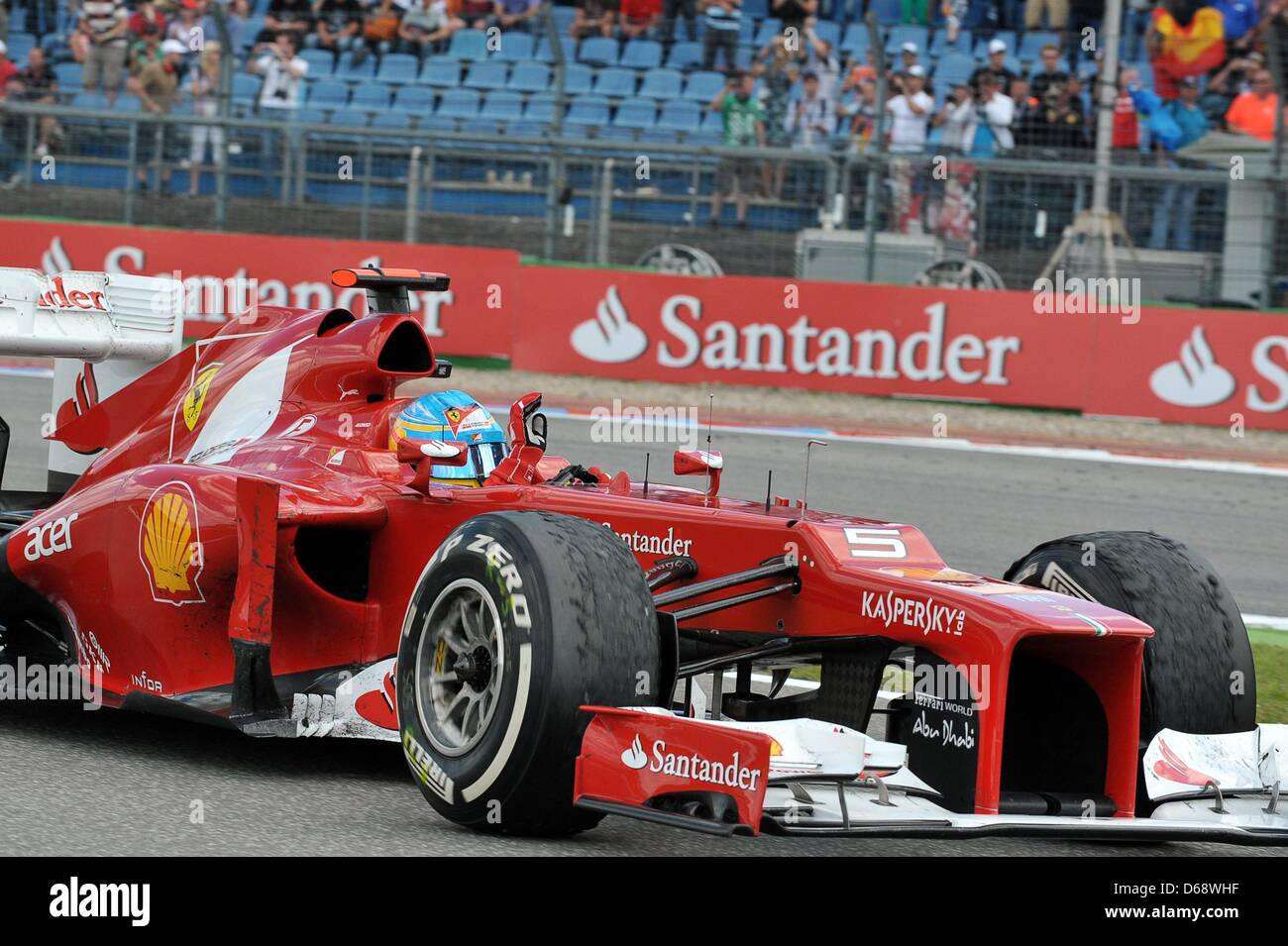 Spanish Formula One driver Fernando Alonso of Ferrari waves to the fans ...