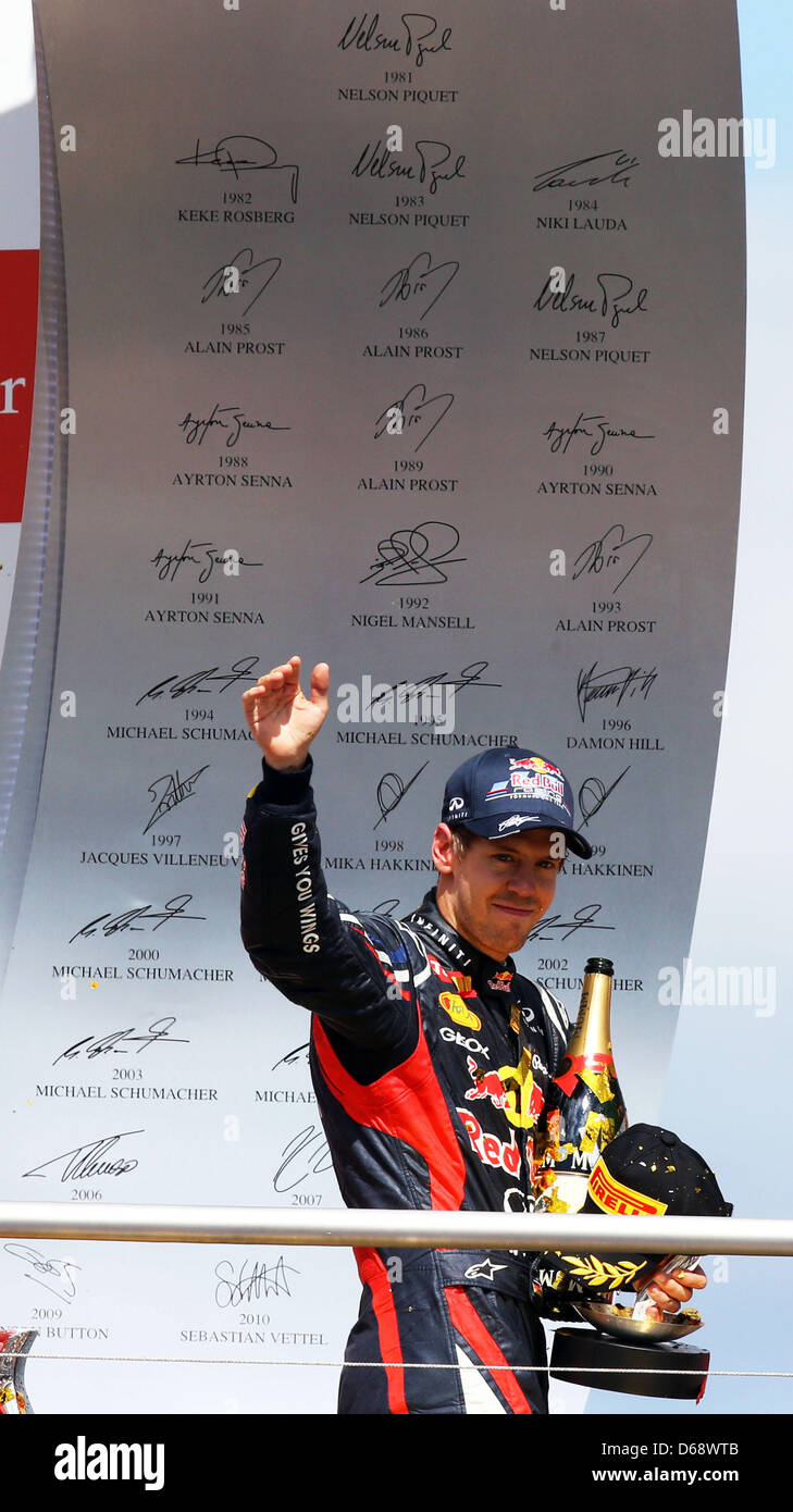 Second placed German Formula One driver Sebastian Vettel of Red Bull on ...