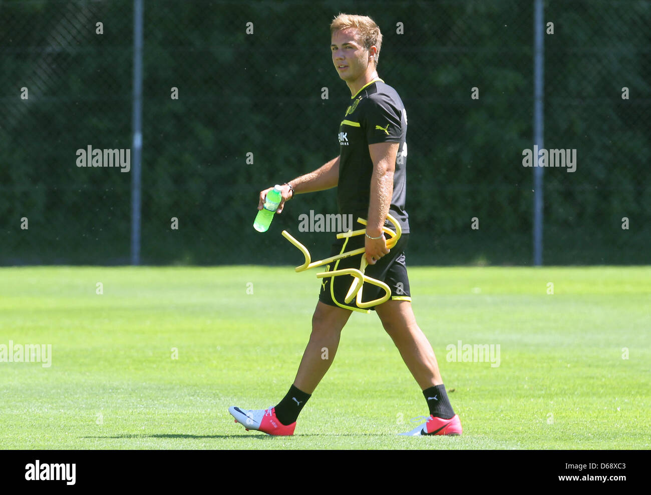 Player of Bundesliga soccer club Borussia Dortmund Mario Goetze tidies ...