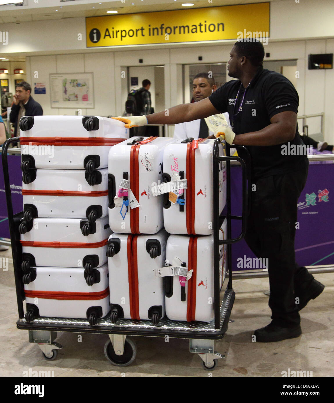 Baggage of the team from Switzerland arrive at Heathrow airport in ...