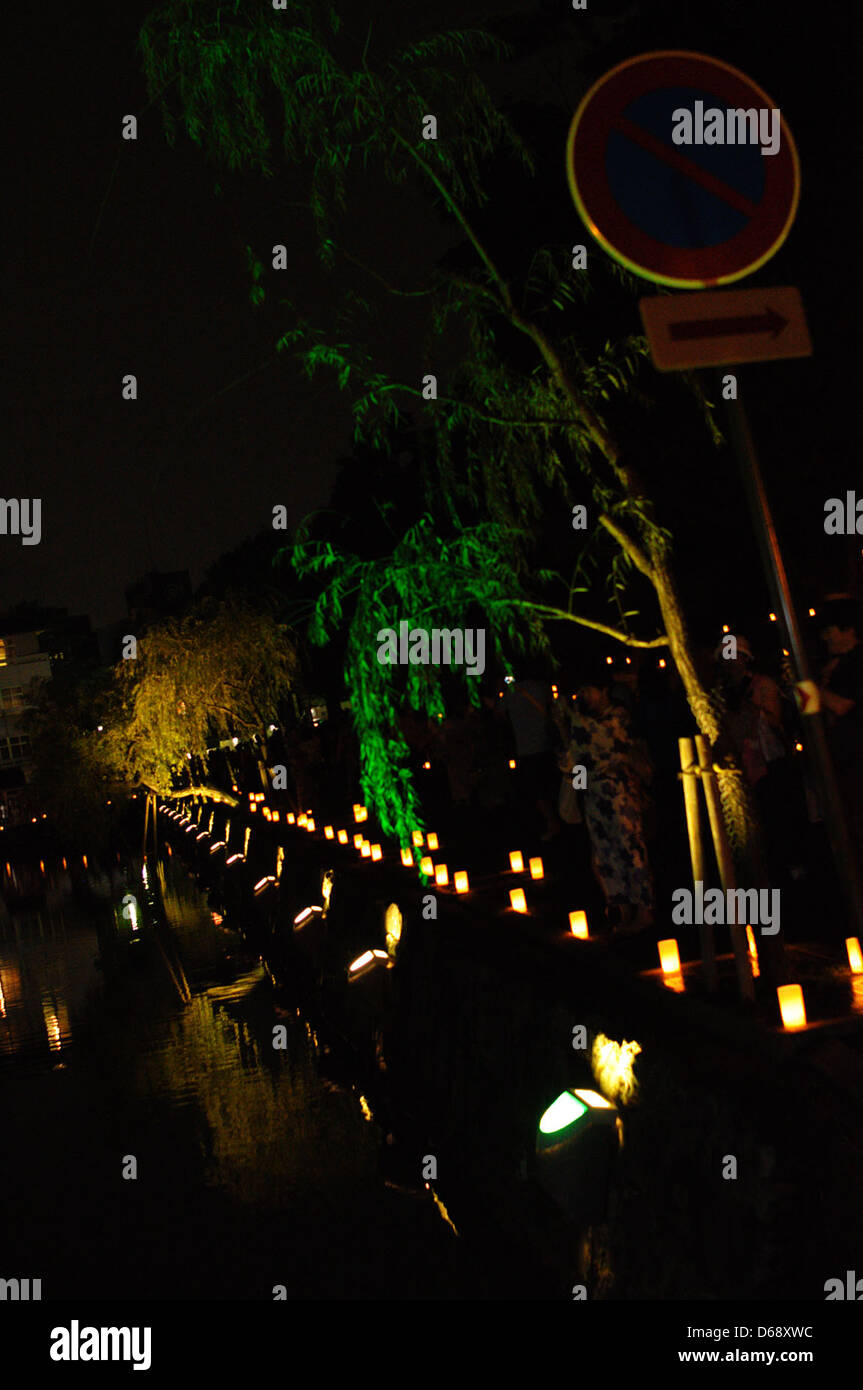 This image shows the candle lighting event during the Toukae festival ...