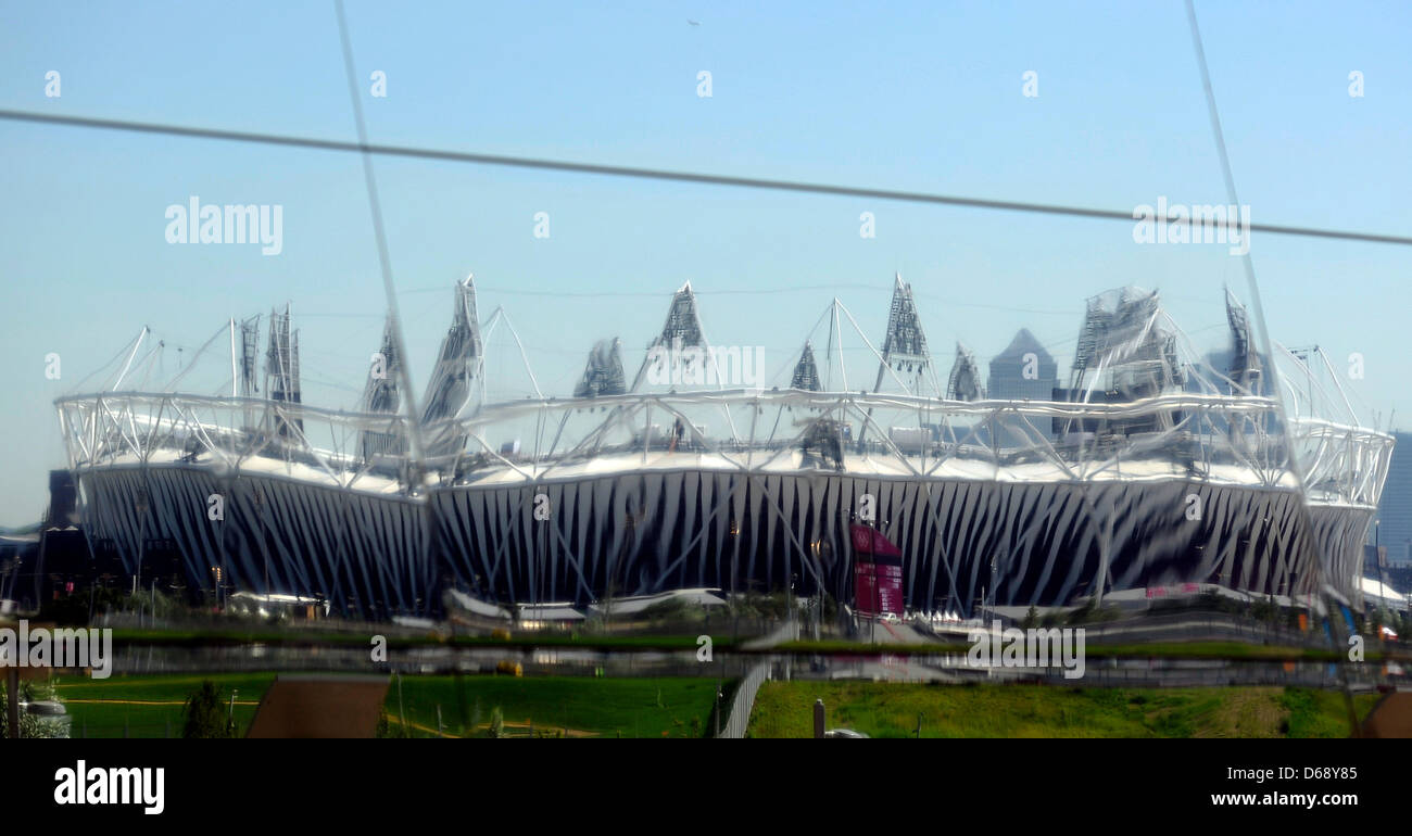 The Olympic stadium is reflected in a window in the Olympic Park in ...