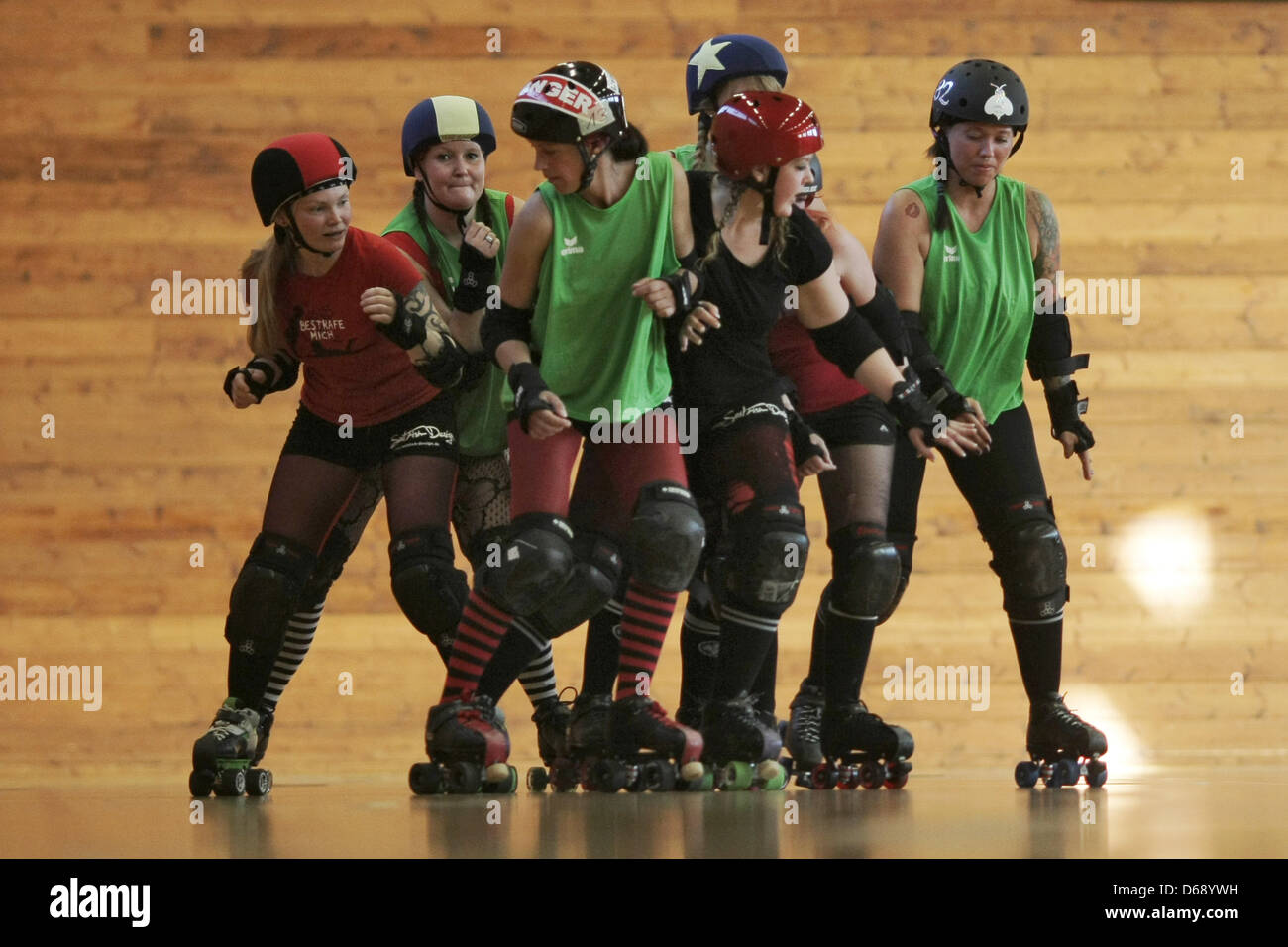 The members of the Bembel Town Rollergirls practice in a gymnasium in ...