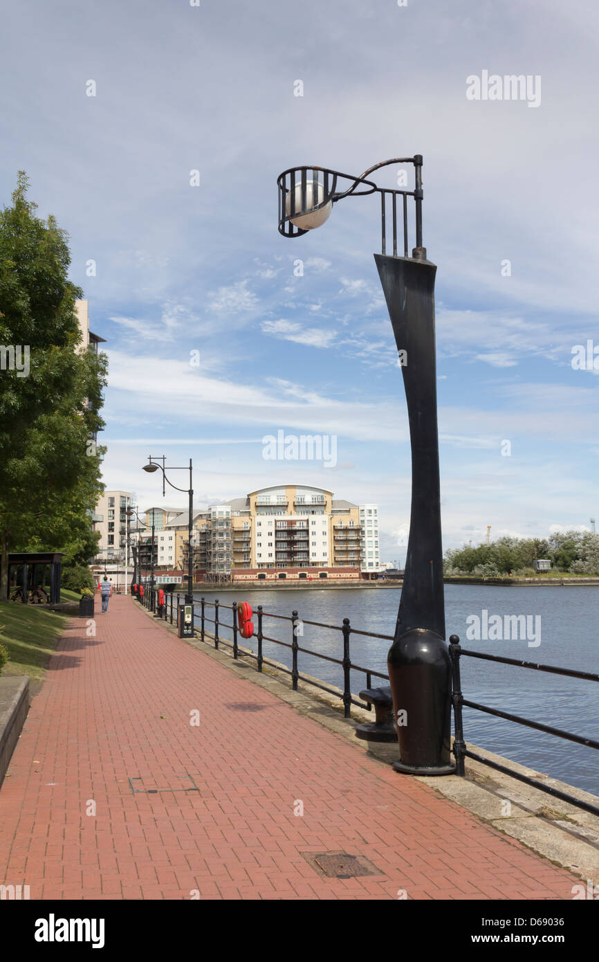 Quayside walk leading to a newly built postmodern apartment block on ...