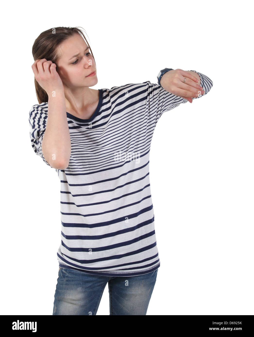 Teenager schoolgirl looking to the watch Stock Photo - Alamy