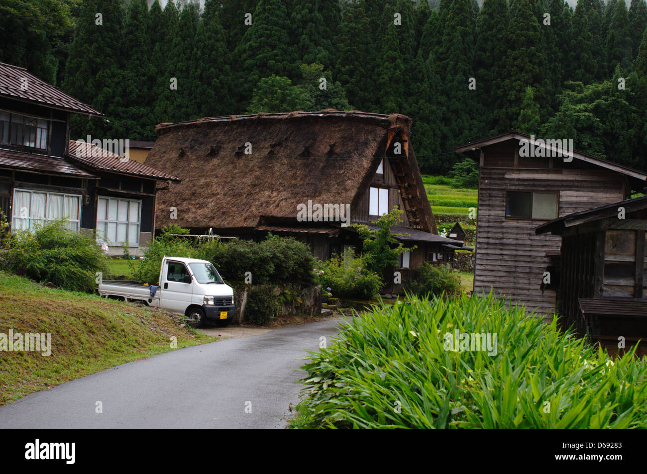 The image depicts a traditional Gassho-zukuri house in Shirakawago ...