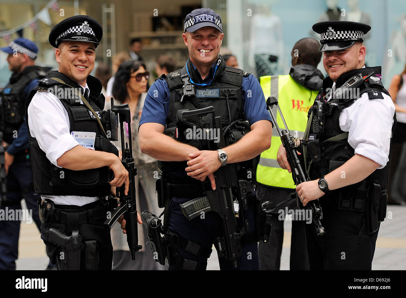 Police officers with machine guns and bullet proof vests patrol near ...