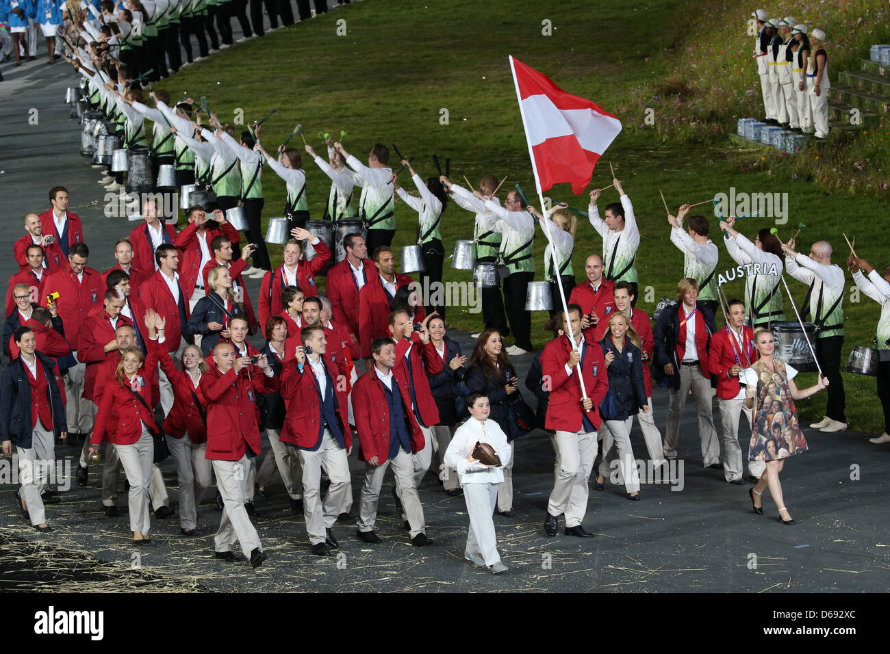 Austrian flag bearer Markus Rogan leads the team into the Olympic ...