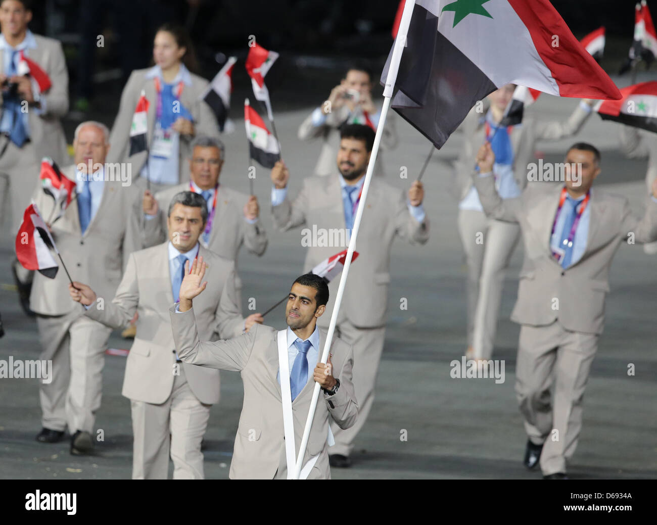 Olympic team of Syrian Arab Republic with flag bearer and athlete Majed ...