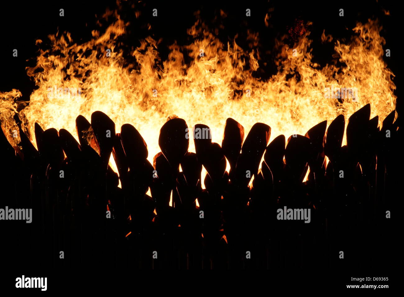 The Olympic Flame is lit in the Olympic stadium during the Opening ...