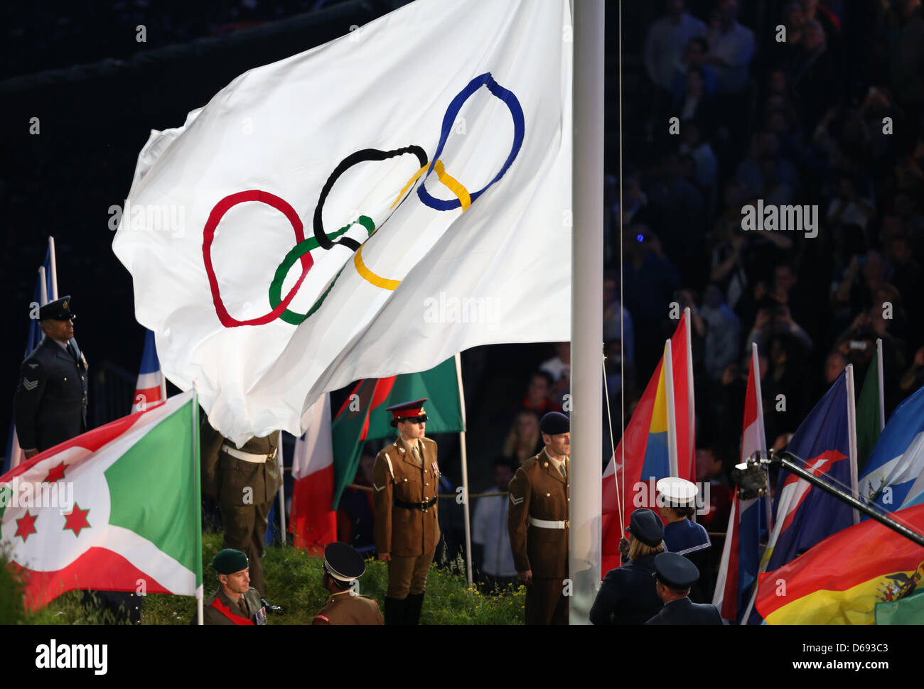 The olympic flag is raised during the Opening Ceremony of the London ...