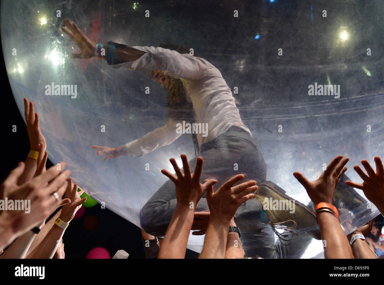 Wayne Coyne, singer of the US band The Flaming Lips, is carried by the ...
