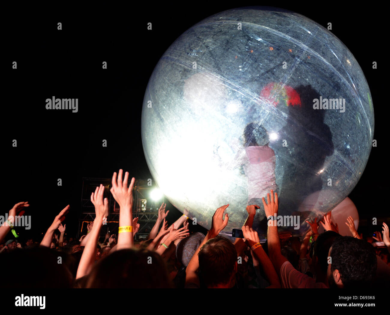 Wayne Coyne, singer of the US band The Flaming Lips, is carried by the ...