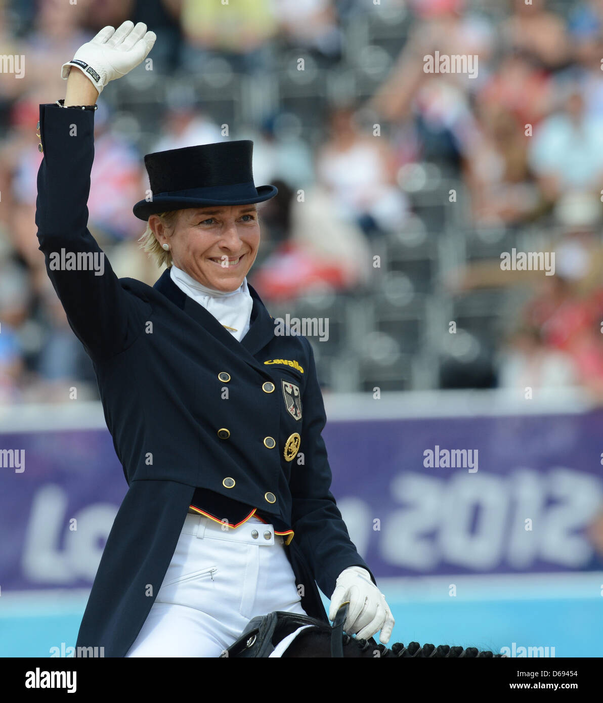 German eventing rider Ingrid Klimke reacts after performing with her ...