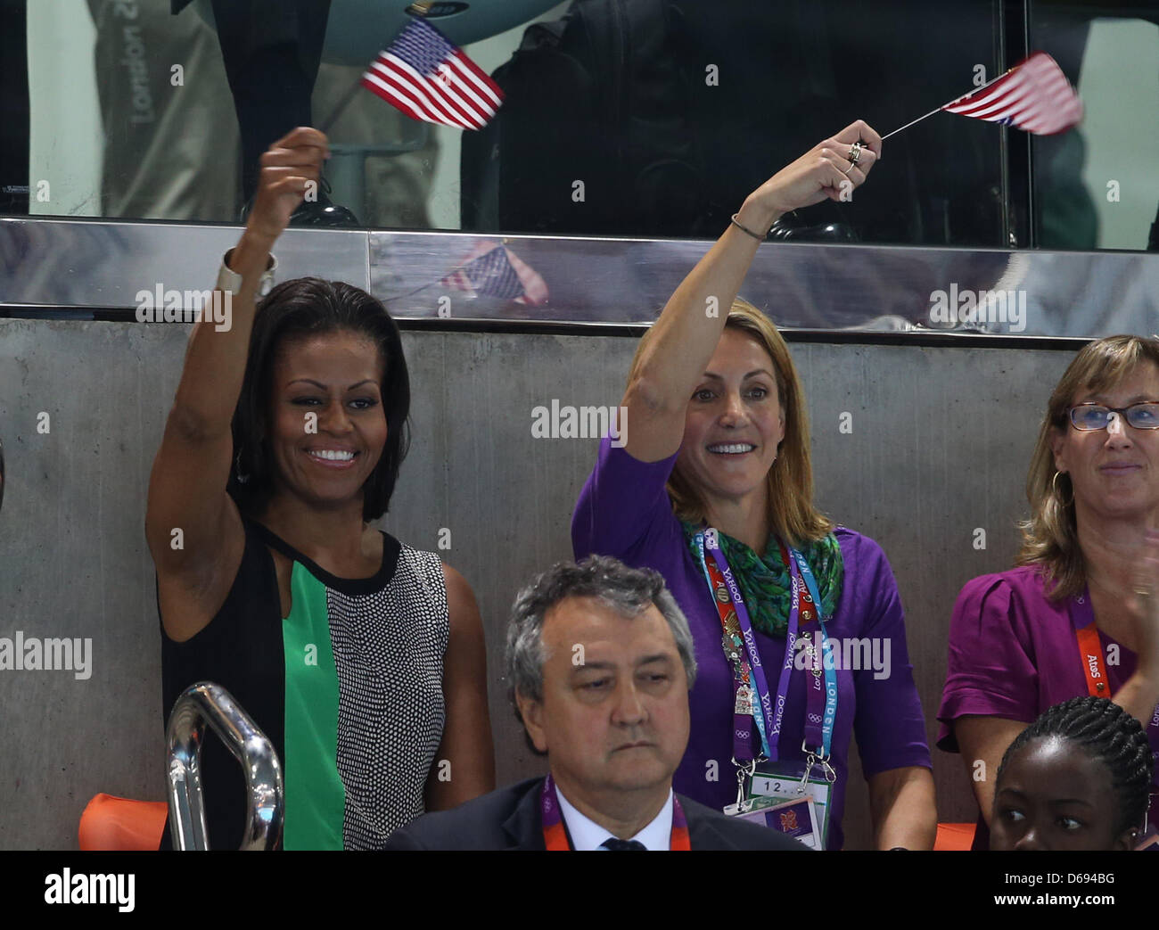 Michelle Obama (L) attends the swimming competition at the Aquatics ...