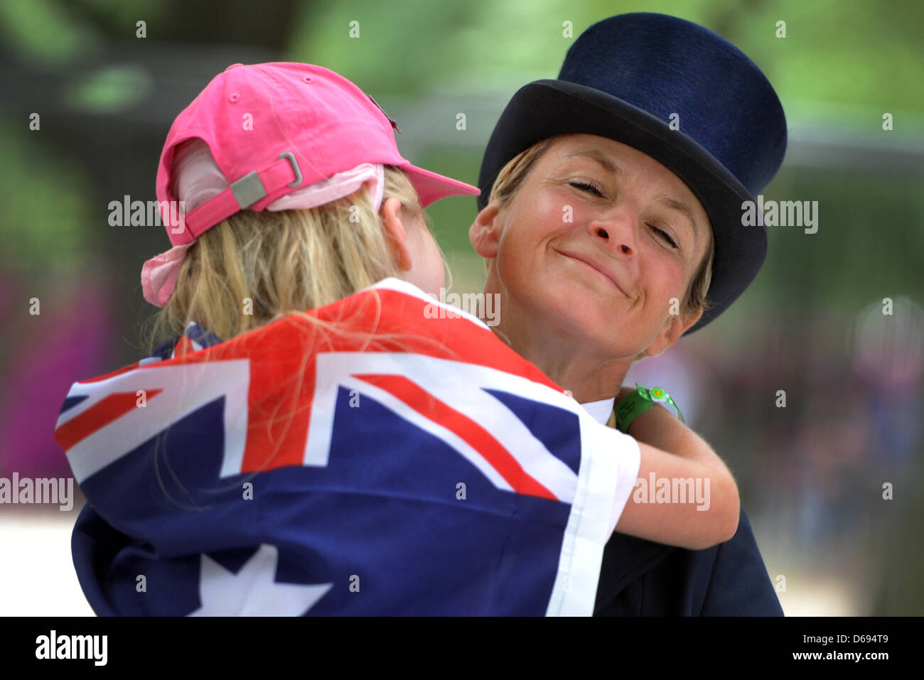 Australian eventing rider Lucinda Fredericks hugs her eight year old daughter Ellie at the ...