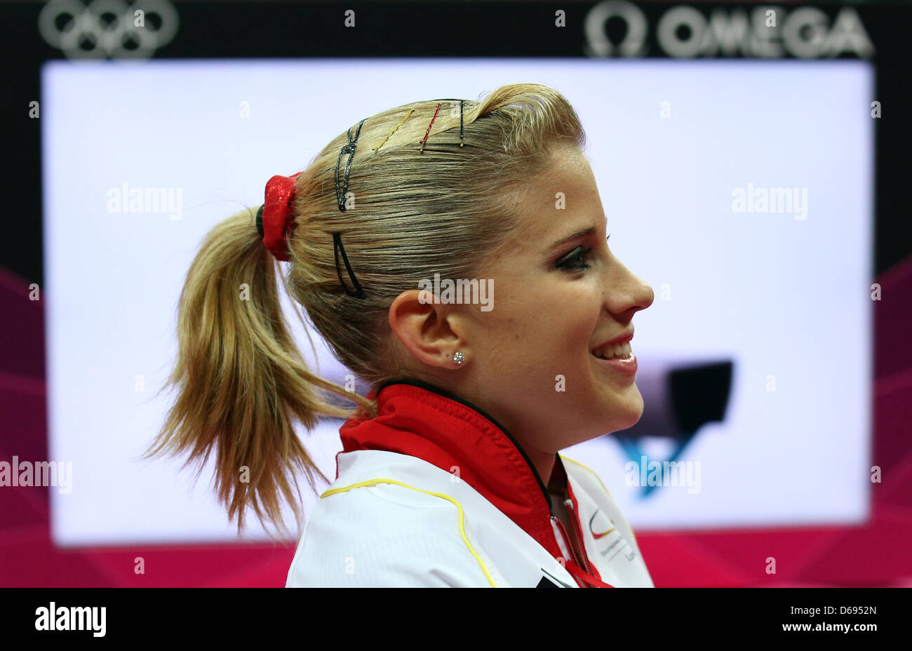 German gymnast Elisabeth Seitz smiles after performing on the vault ...