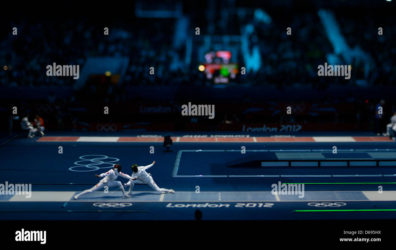 Germany's Imke Duplitzer (R) competes with China's Yujie Sun during the ...