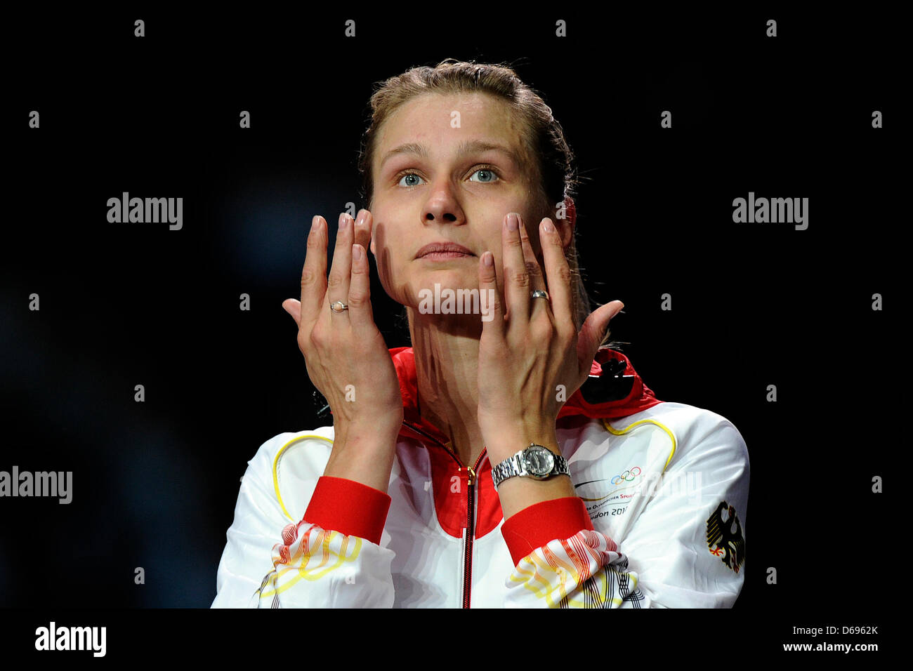 Germany's Britta Heidemann cries during the medal ceremony for the ...