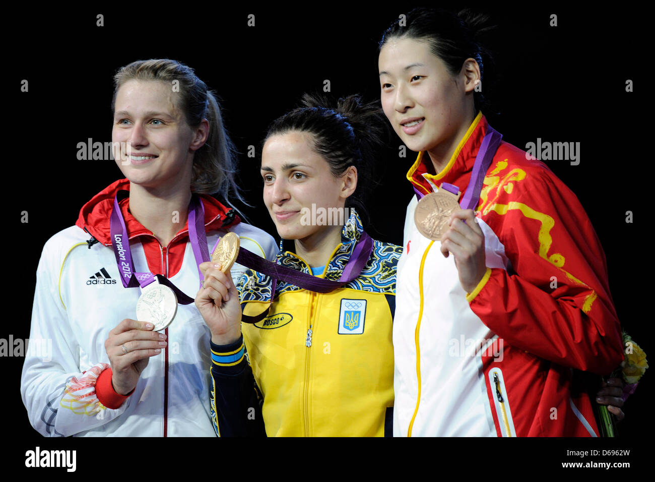 Silver medal winner Britta Heidemann (L) of Germany, Gold medal winner ...