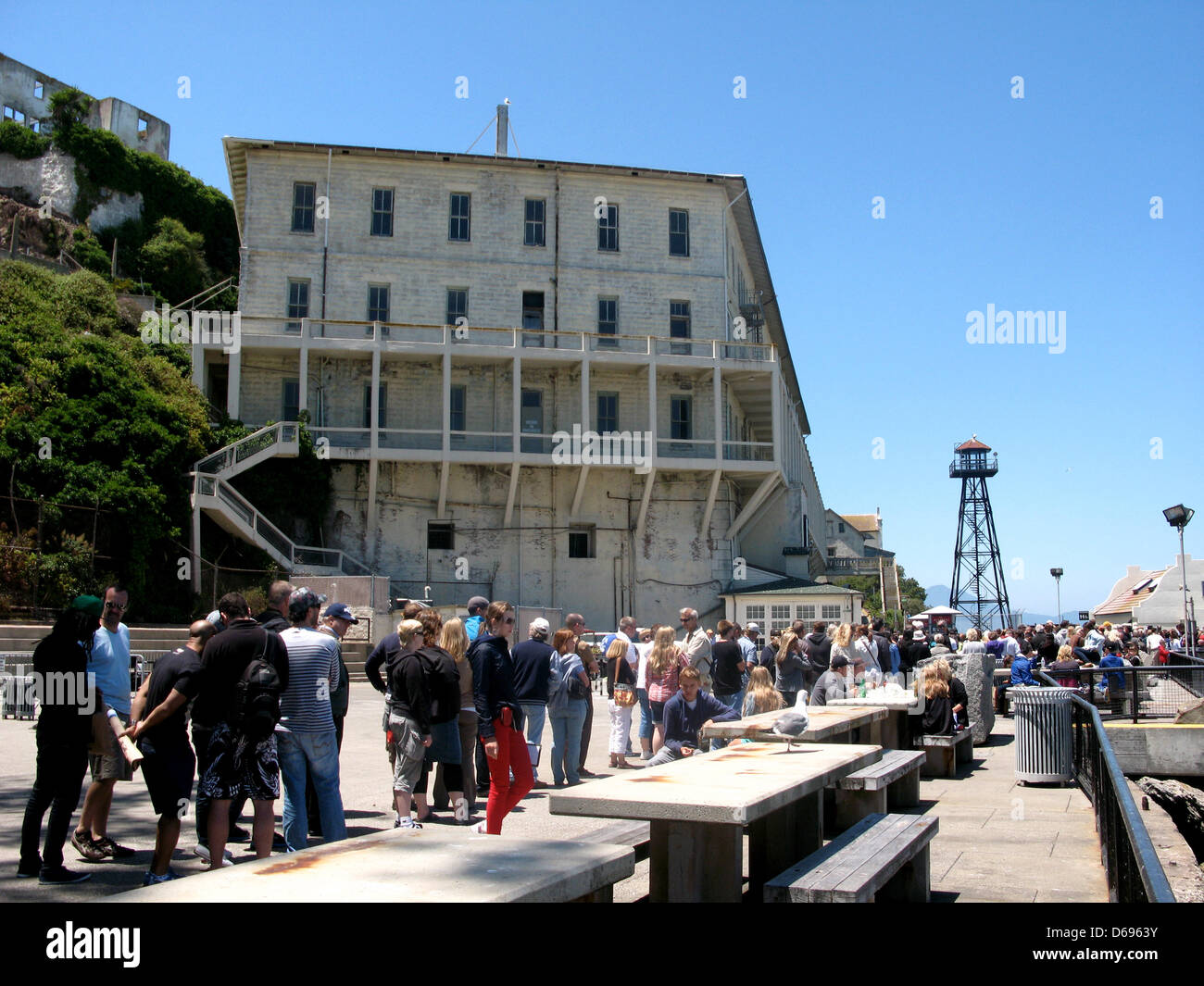 Tourists prepare to board a ship on the infamous prison island of ...